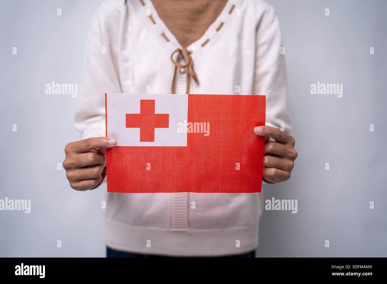Hands Holding National Flag of Tonga Stock Photo - Alamy