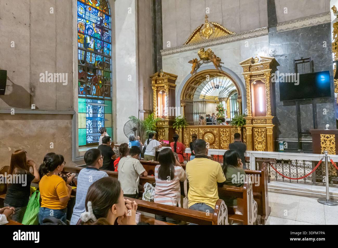Religious service, interior of the Basilica Minore del Santo Niño de ...