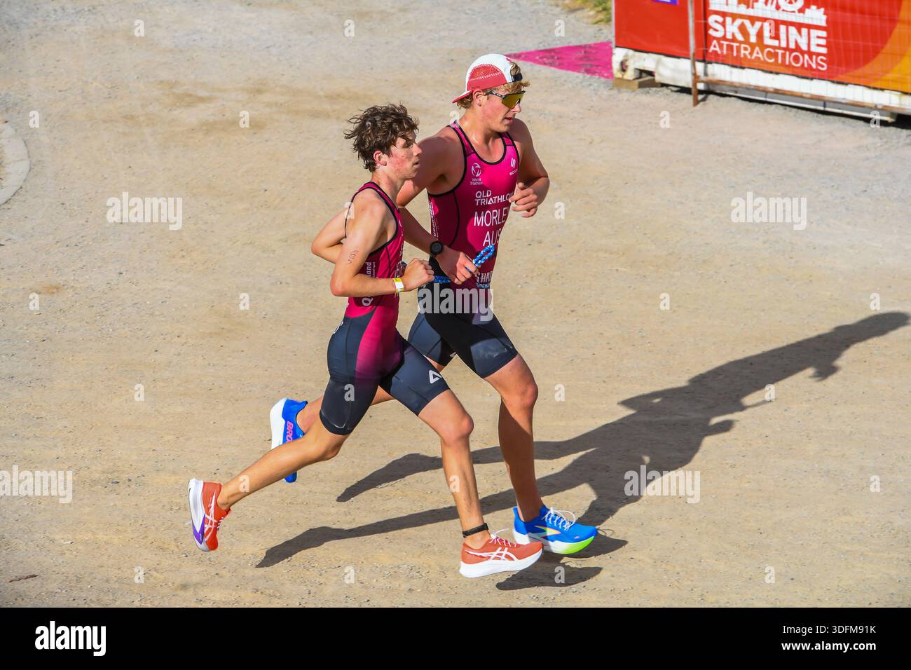 Vision impaired triathlete Brody Velthuis (L) seen in action with his ...