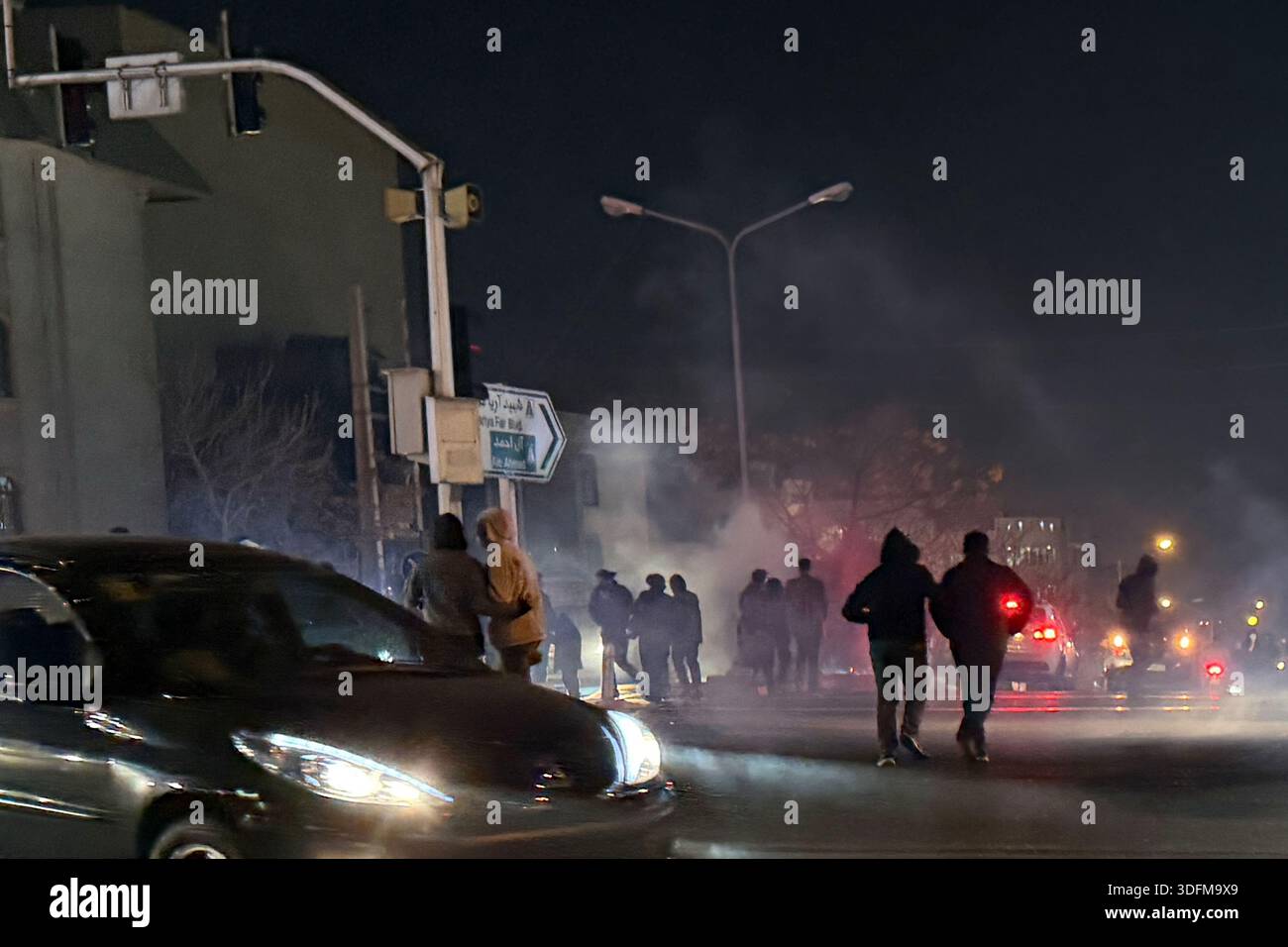 Tear gas is fired during an anti-government protest in Tehran, Iran ...