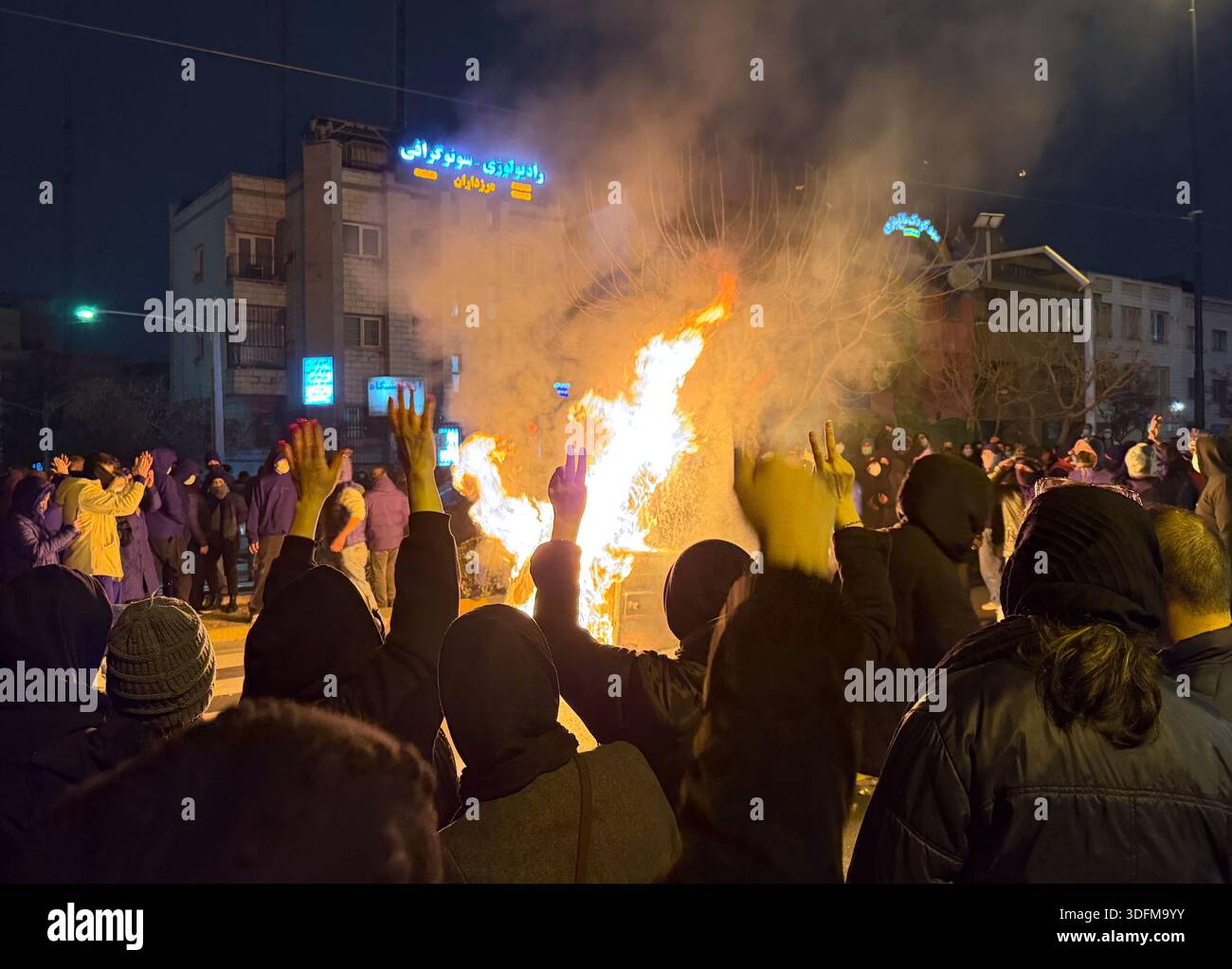 Iranians attend an anti-government protest in Tehran, Iran, Friday, Jan ...
