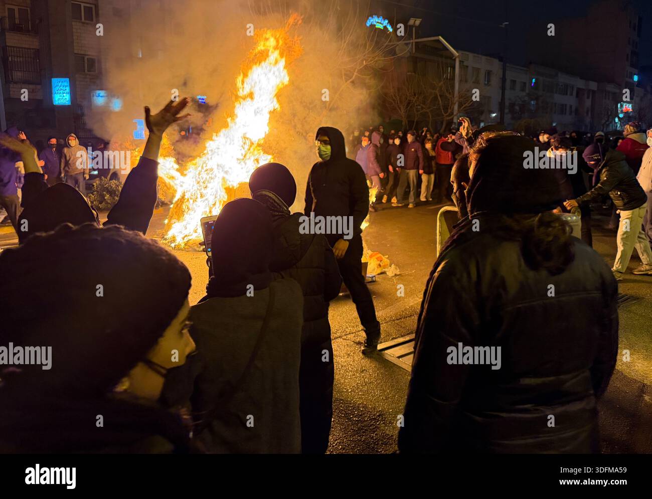 Iranians attend an anti-government protest in Tehran, Iran, Friday, Jan ...