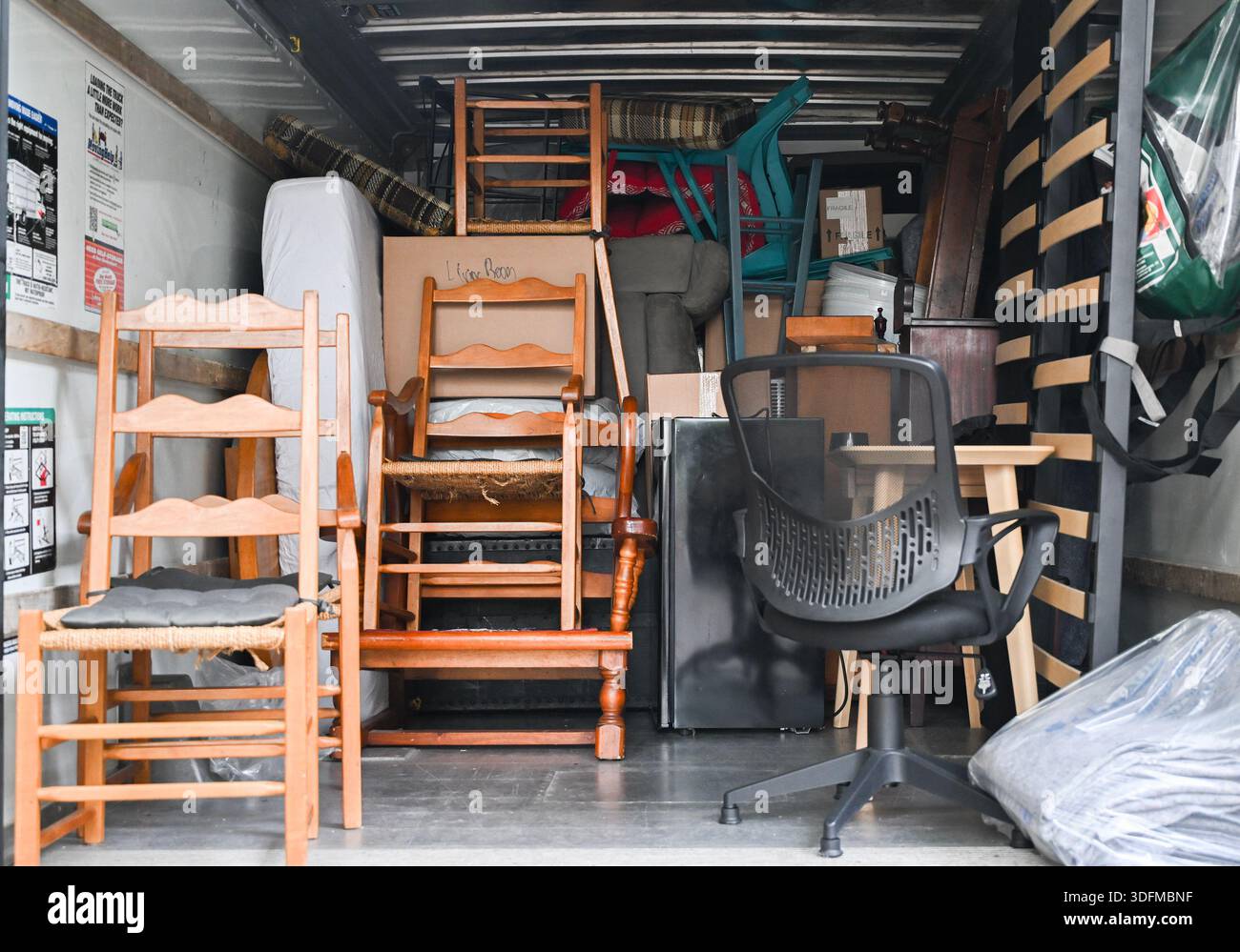 A truck packed with furnishings and belongings is shown on Quebec's ...