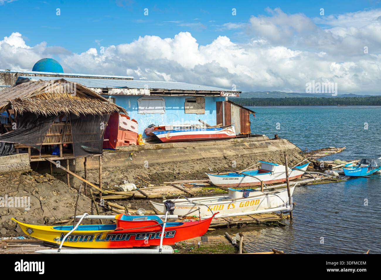 Traditional hut house and traditional Fishing boats at the Fishing ...