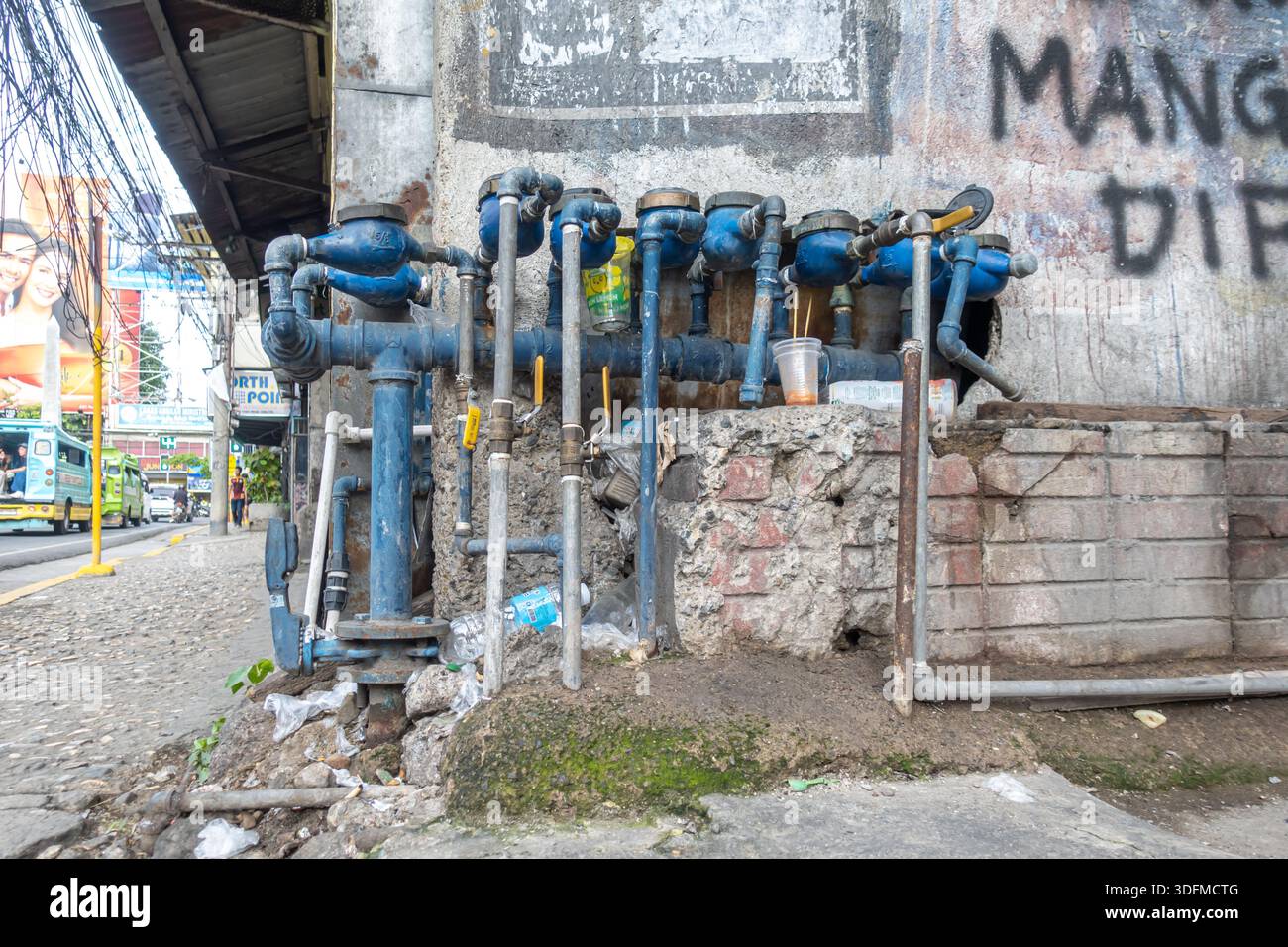 water meters and associated plumbing pipes installed on the exterior of ...