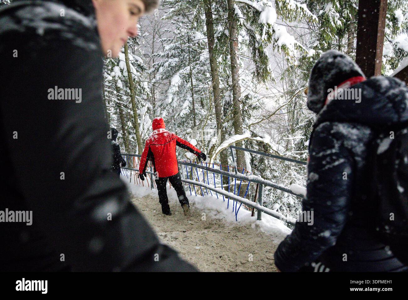 Sport fans walk on the hill during the FIS Ski Jumping World Cup Large ...