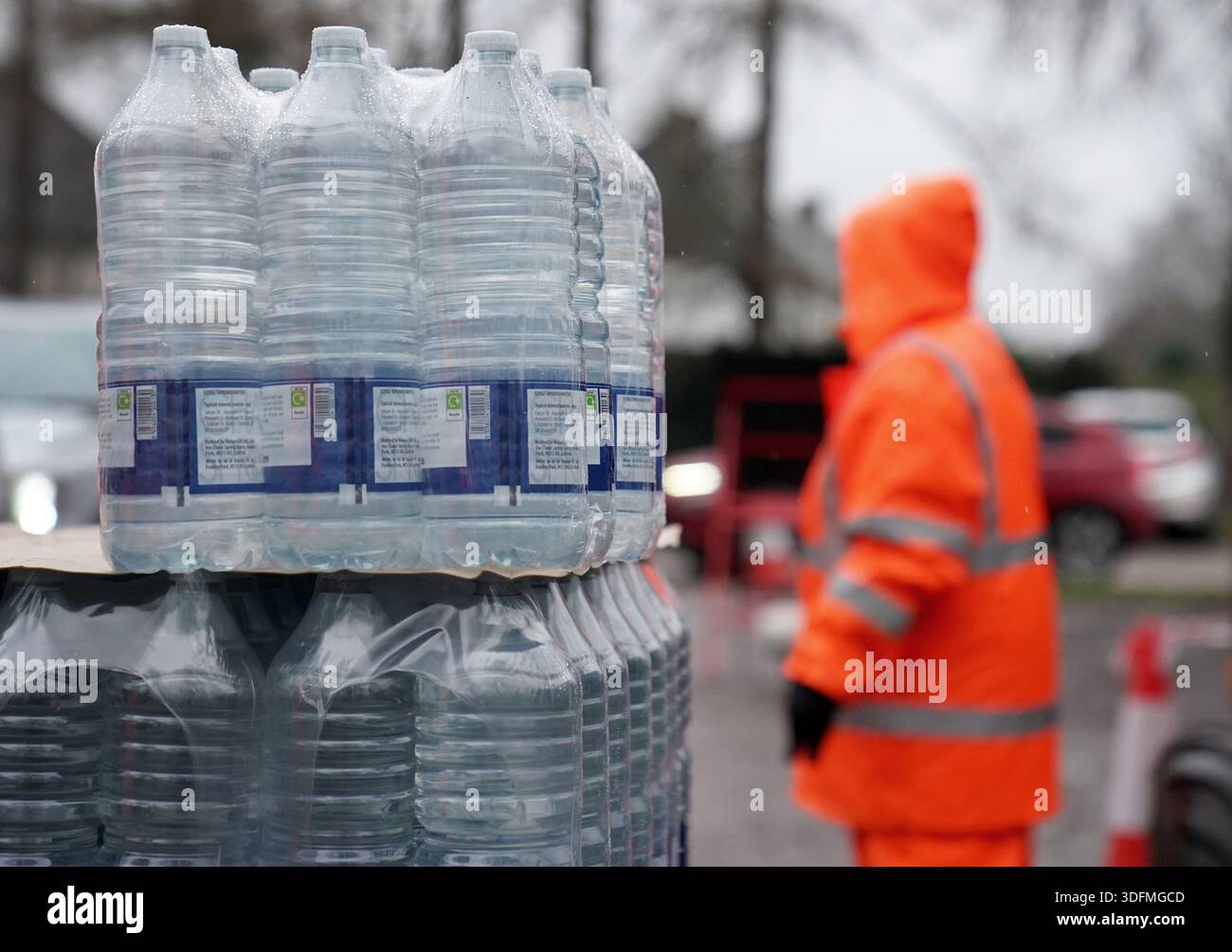 South East Water staff hand out bottled water at a water station in ...