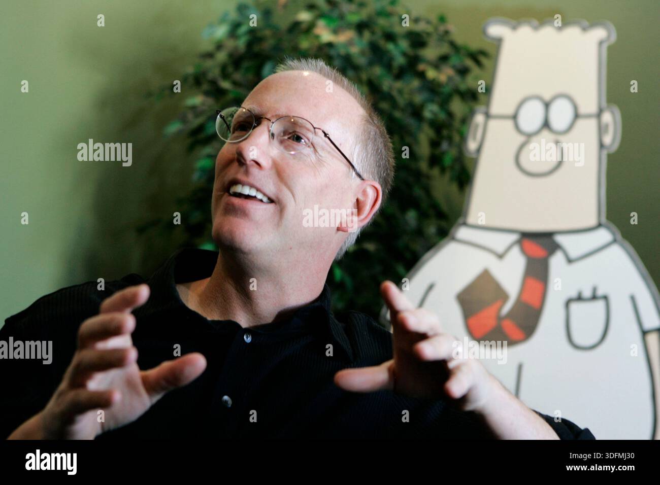 FILE - Scott Adams, creator of the comic strip Dilbert, talks about his ...