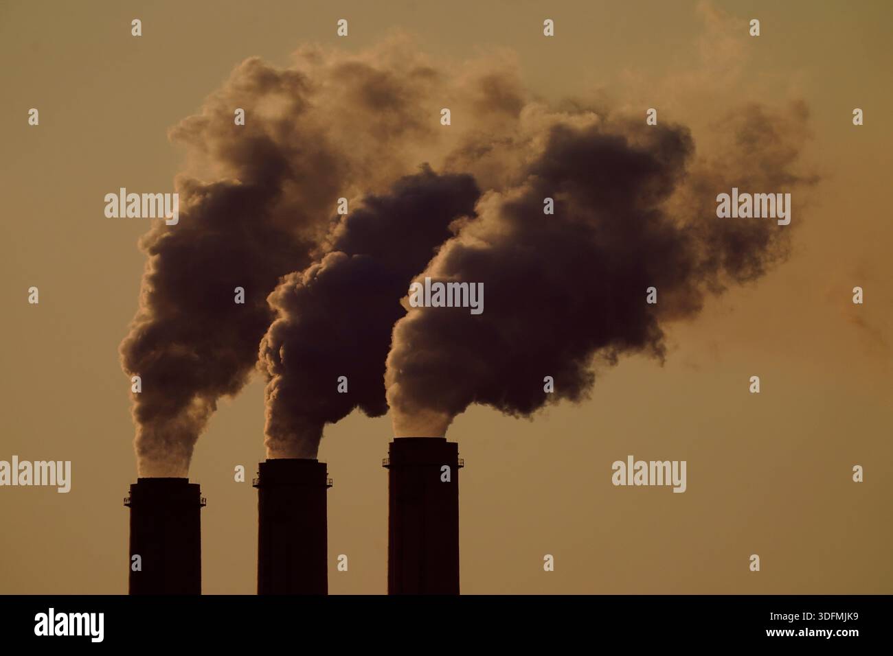 FILE - Emissions rise from the smokestacks at the Jeffrey Energy Center ...