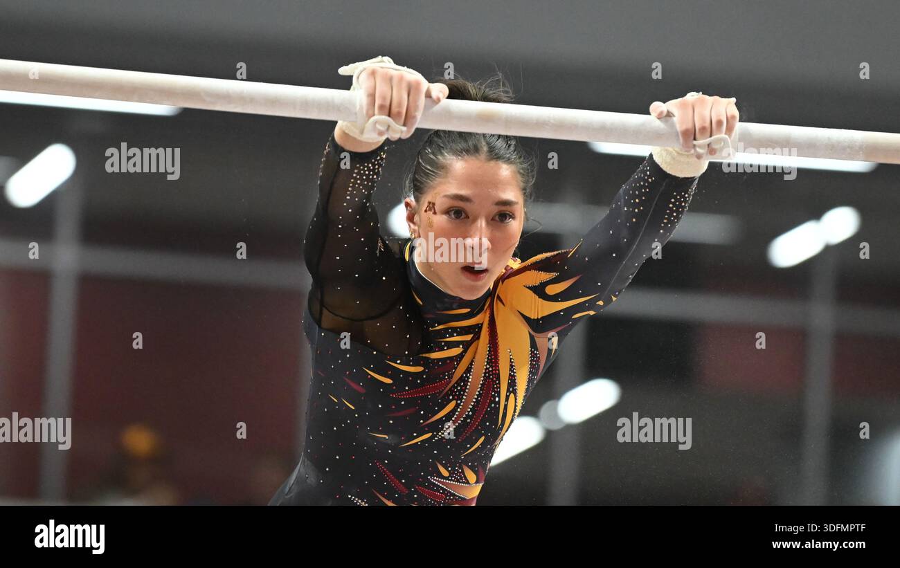 Minnesota's Isabella Nguyen competes on the uneven parallel bars ...