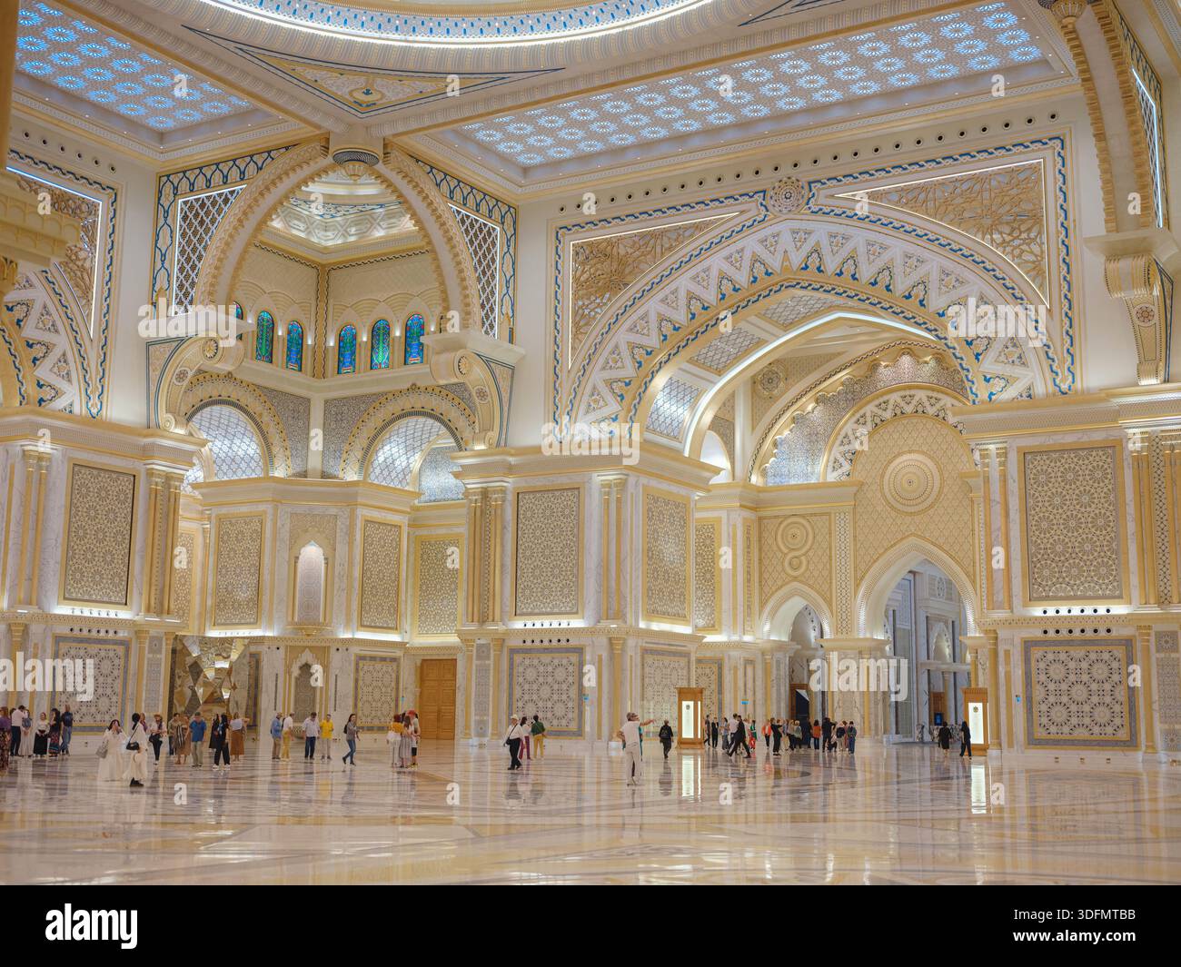 Abu Dhabi, UAE January 15, 2024 Visitors walk in grand interior halls ...