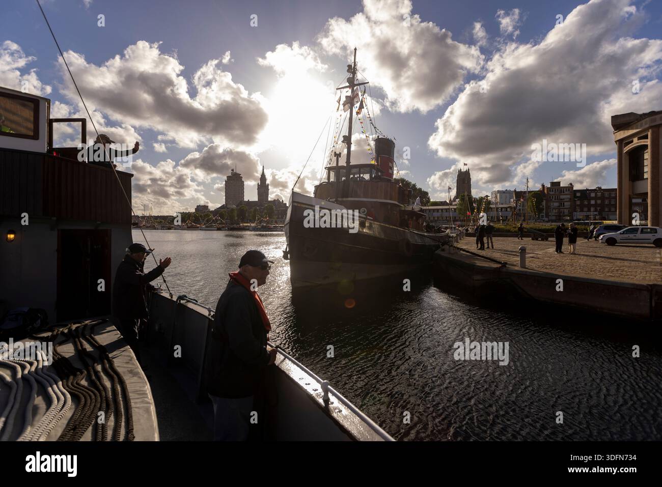HMT Watchful leaving Dunkirk Harbour and sails past the Steam Tug Boat ...