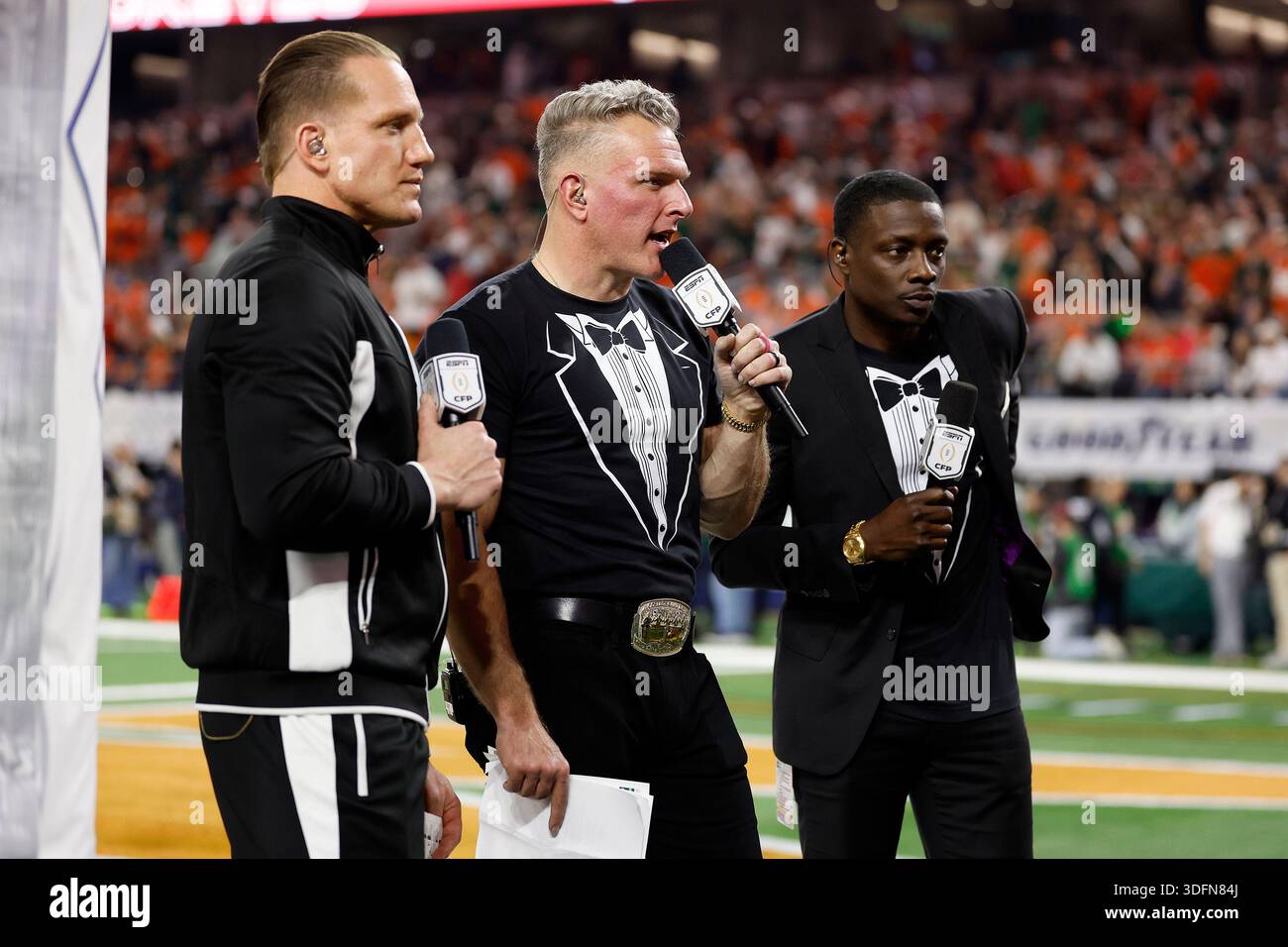 ESPN's Pat McAfee (center) talks about the game from the end zone ...