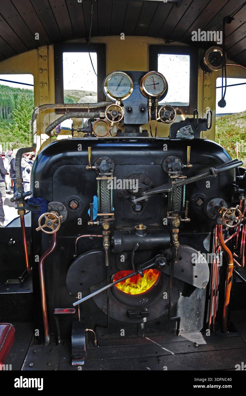 The fire in the firebox in the cab of a steam locomotive on Brecon ...