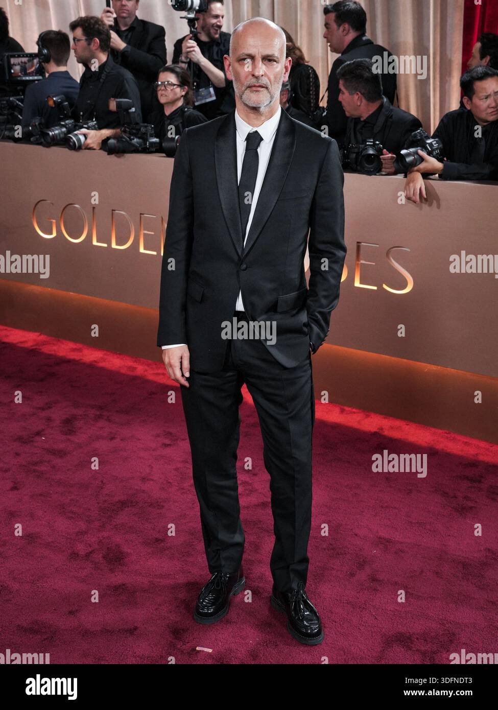 James Wilson walking on the red carpet at The 83rd Annual Golden Globe ...