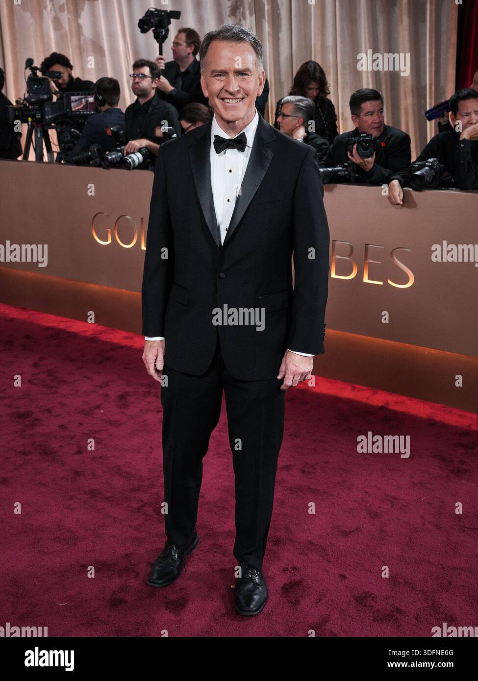 Steve Inskeep walking on the red carpet at The 83rd Annual Golden Globe ...