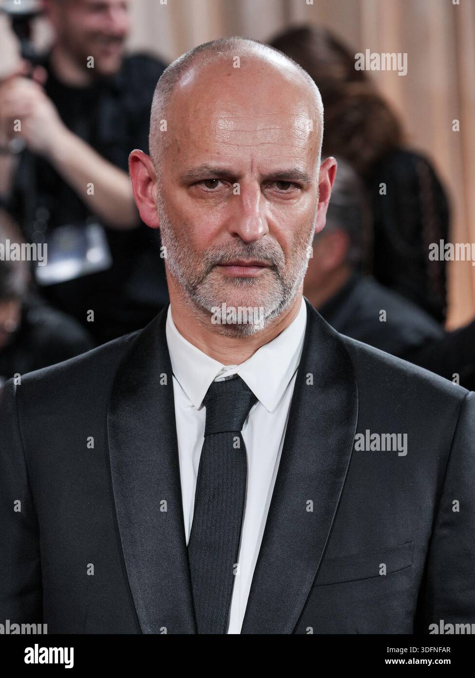 James Wilson walking on the red carpet at The 83rd Annual Golden Globe ...