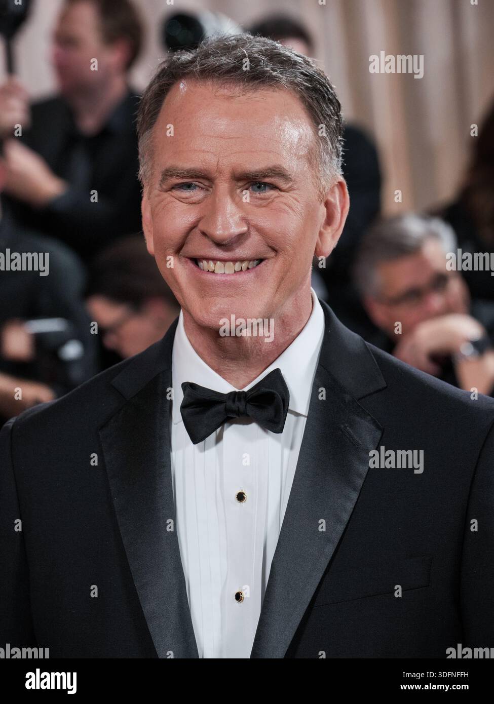 Steve Inskeep walking on the red carpet at The 83rd Annual Golden Globe ...