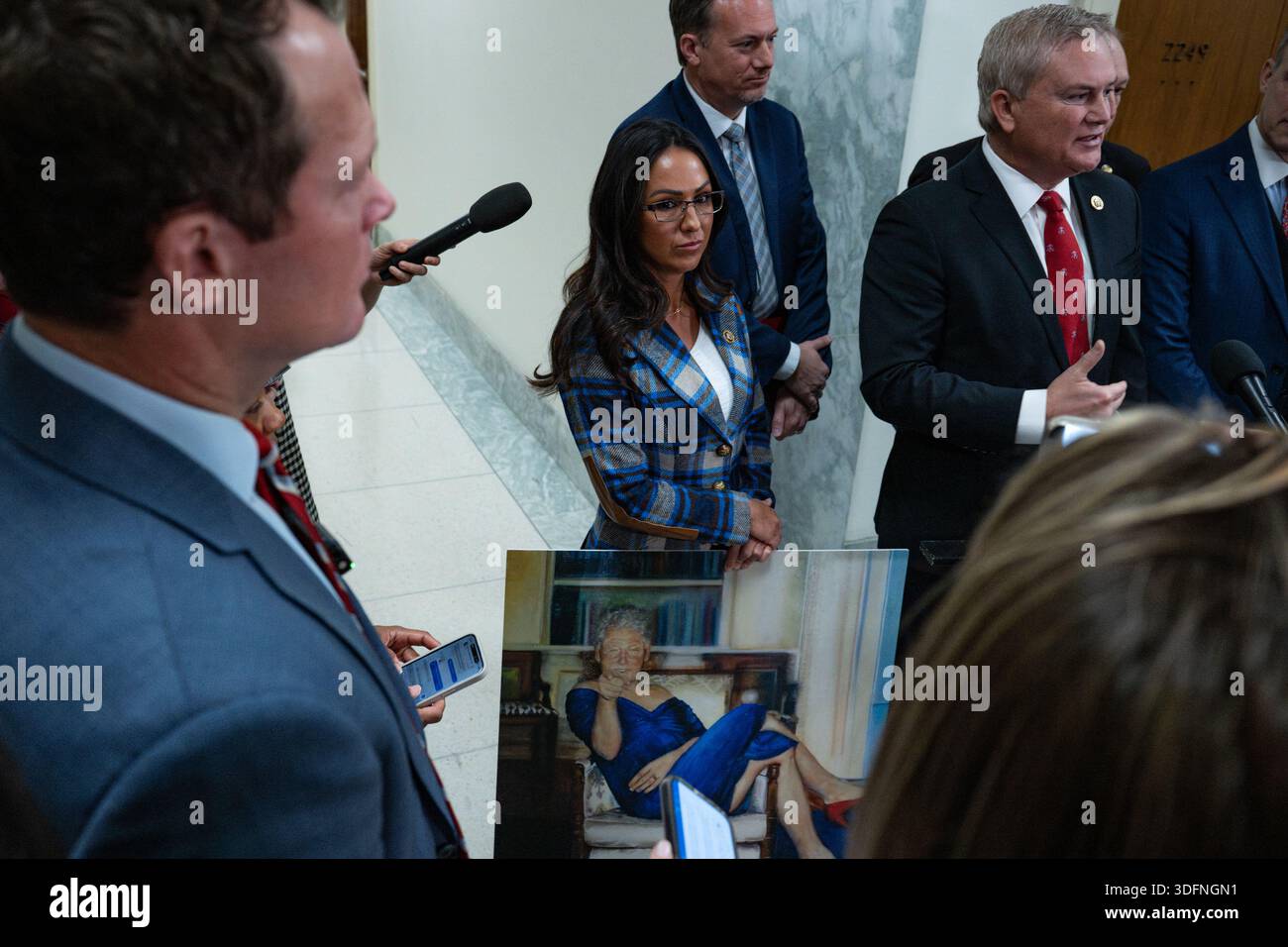 U.S. Rep. Lauren Boebert (R-CO) holds up an image of former U.S ...