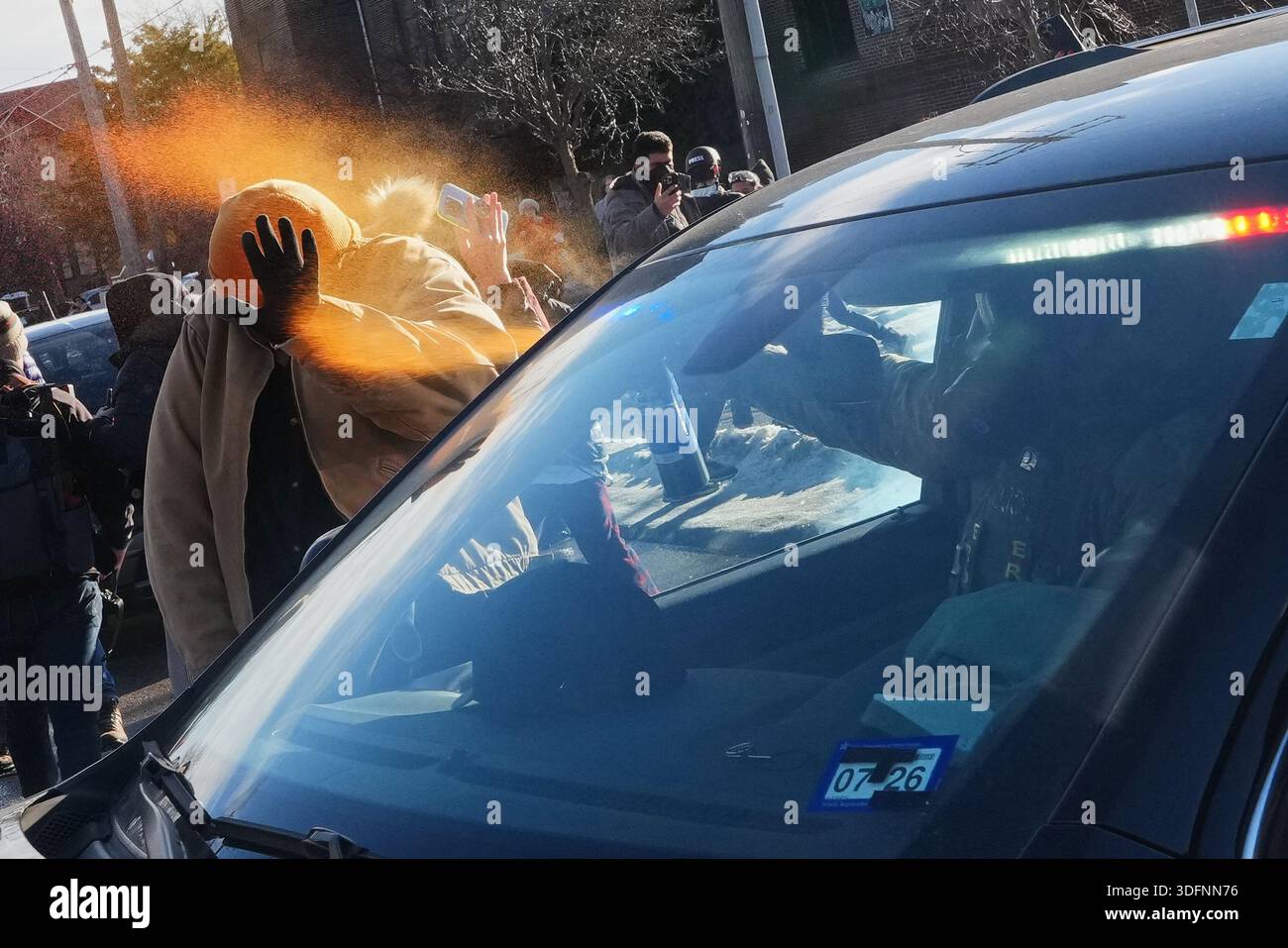 A protester is sprayed with pepper spray by a Federal agent Tuesday ...