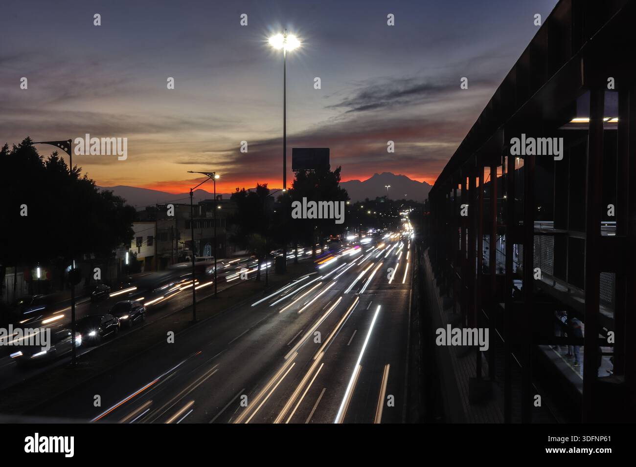 The Iztaccíhuatl volcano is seen through the city streets during ...