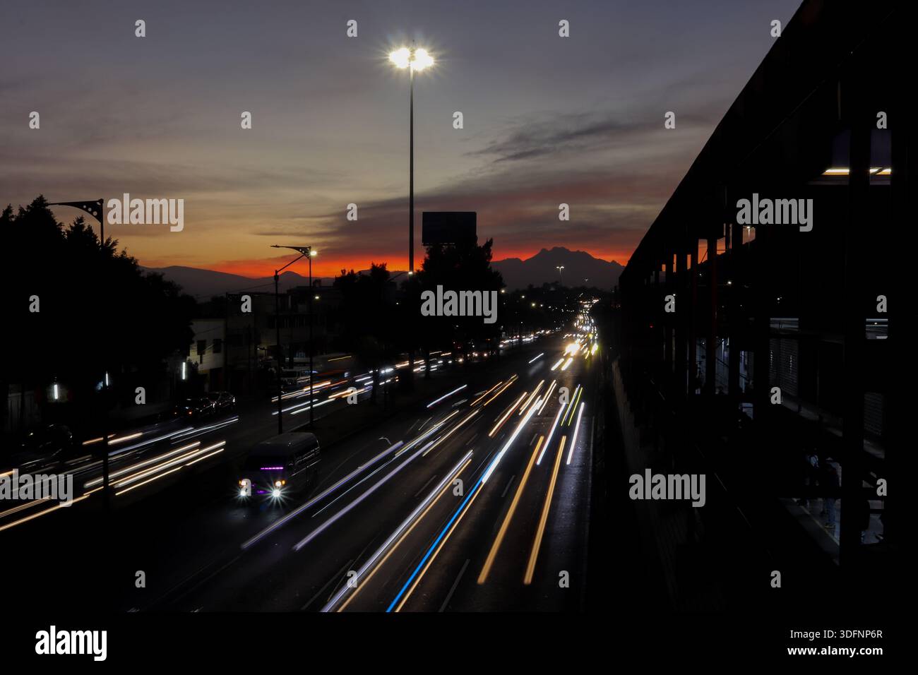 The Iztaccíhuatl volcano is seen through the city streets during ...