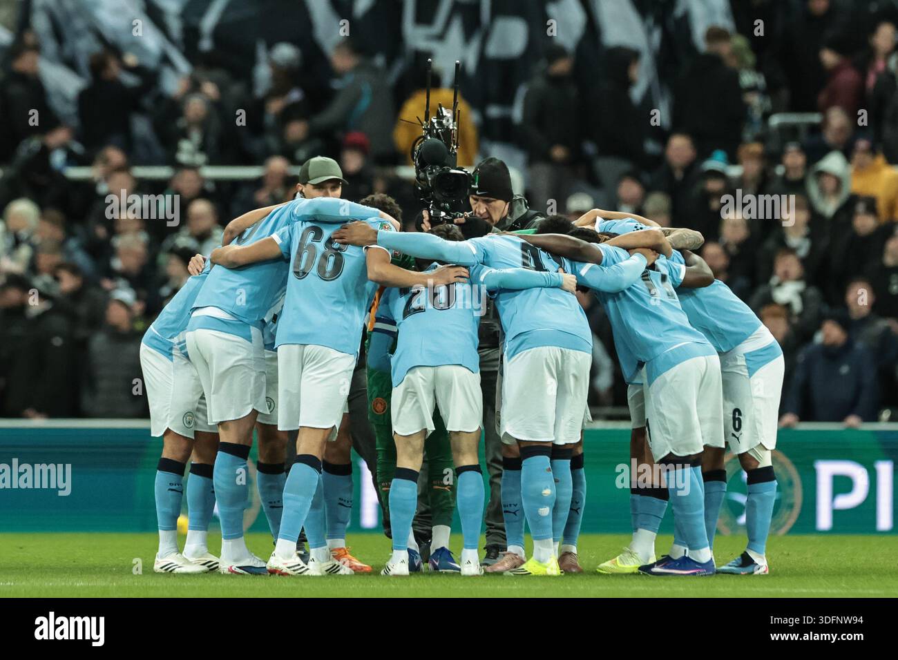 Manchester City team huddle during the Carabao Cup Semi-finals First ...