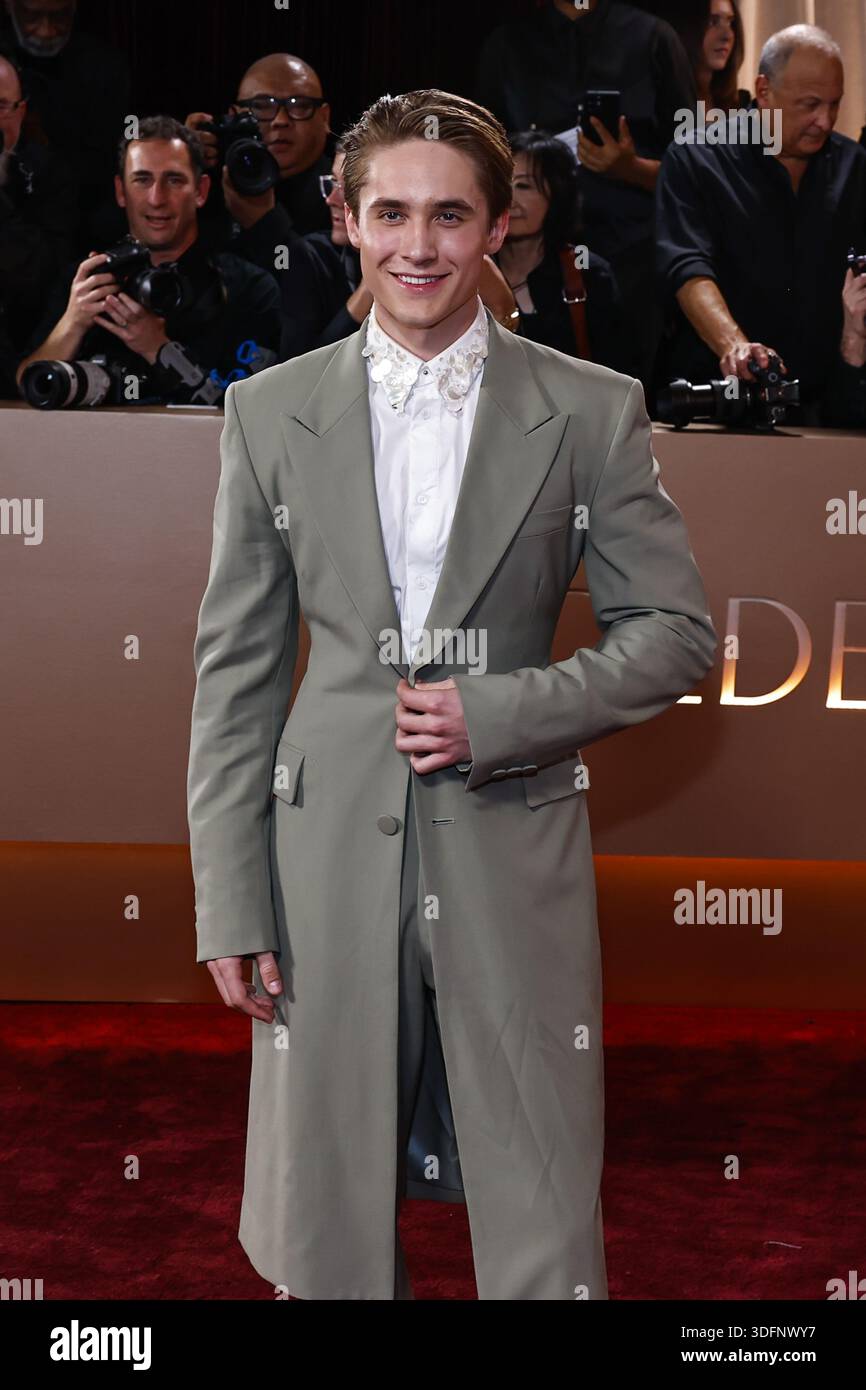 Ollie Muhl walking on the red carpet at The 83rd Annual Golden Globe ...