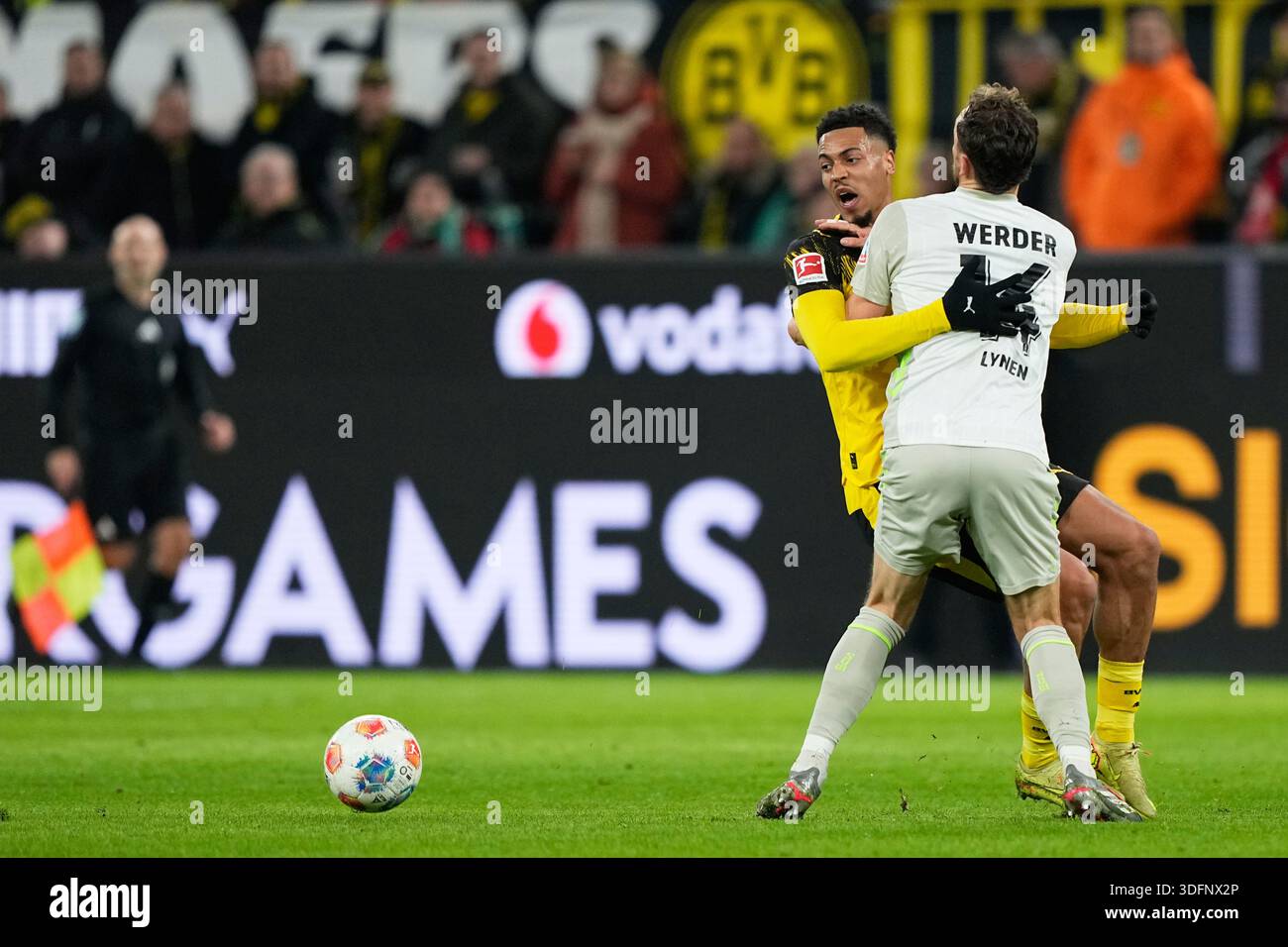 Dortmund's Felix Nmecha, rear, and Bremen's Senne Lynen vie for the ...