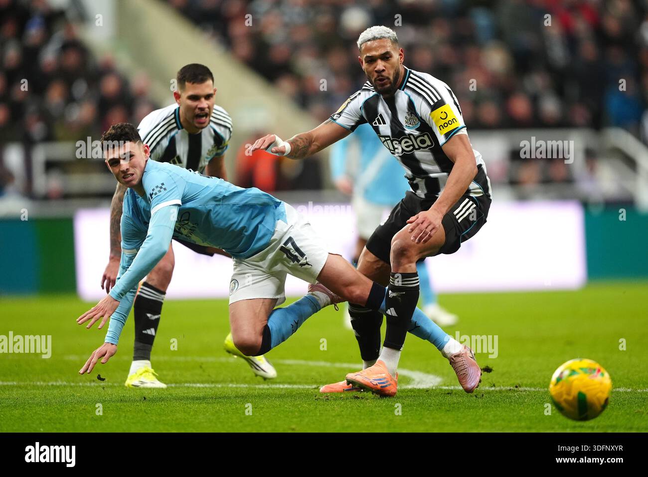Manchester City's Phil Foden (left) nad Newcastle United's Joelinton ...
