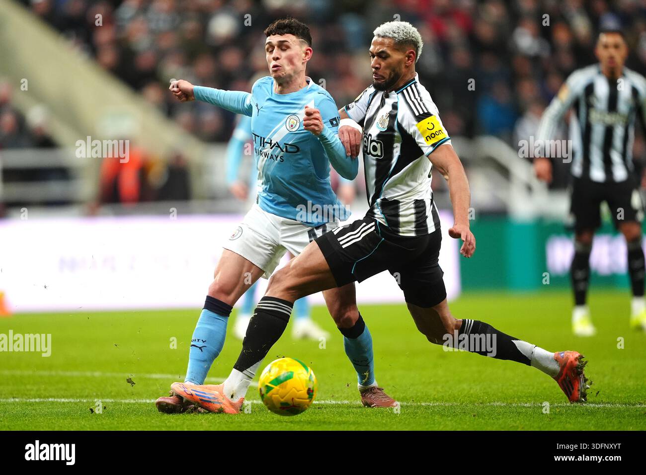 Manchester City's Phil Foden (left) nad Newcastle United's Joelinton ...