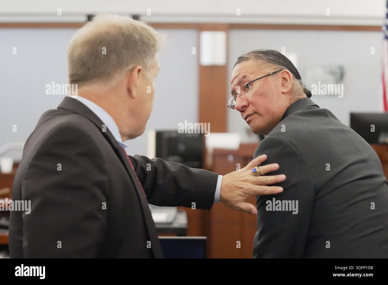 Nathan Chasing Horse, right, talks to his attorney Craig Mueller during ...