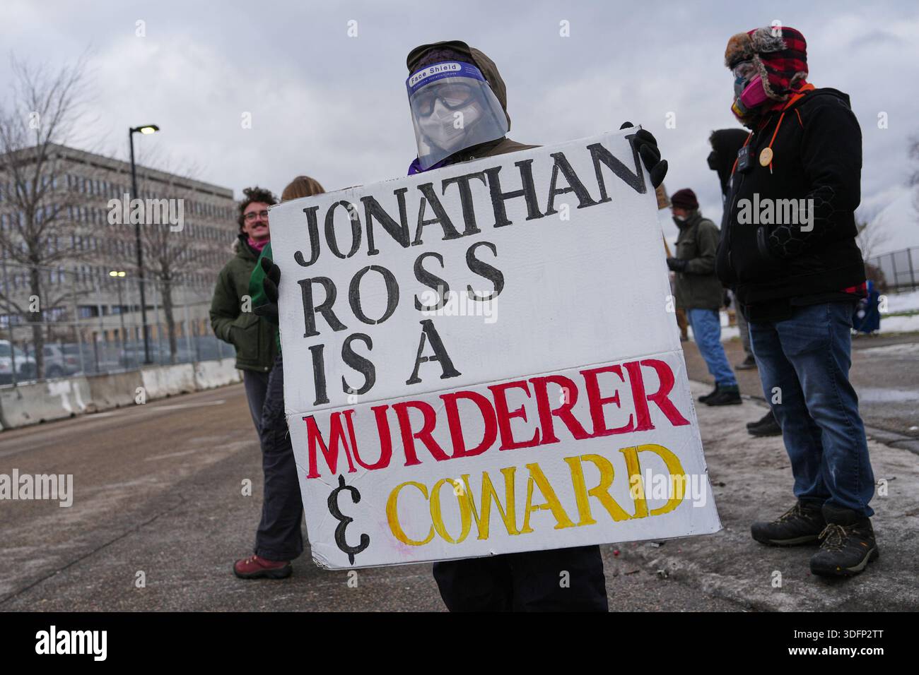 Protesters confront federal immigration officers outside the Bishop ...