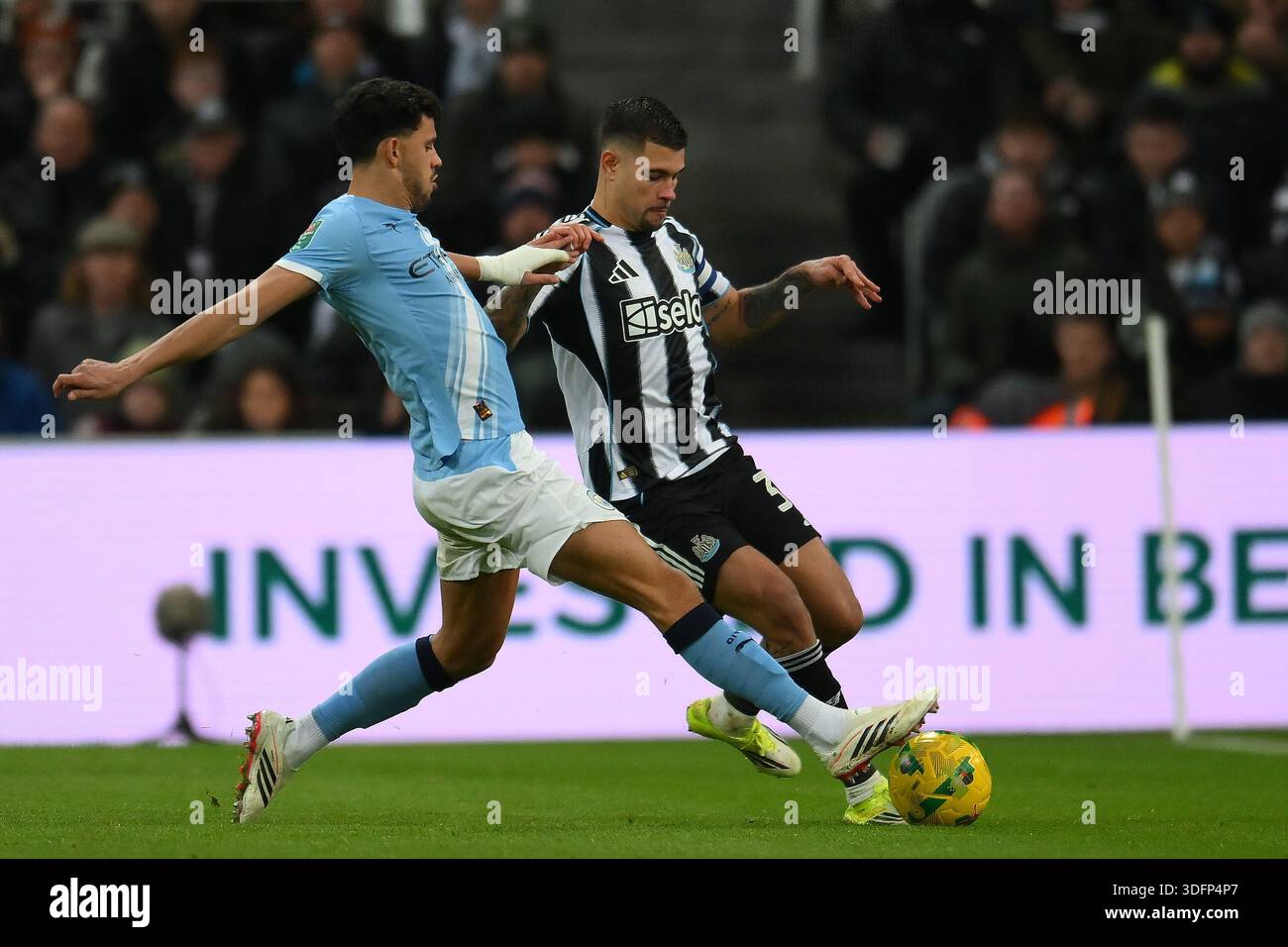 Bruno Guimaraes of Newcastle United in action with Matheus Nunes during ...