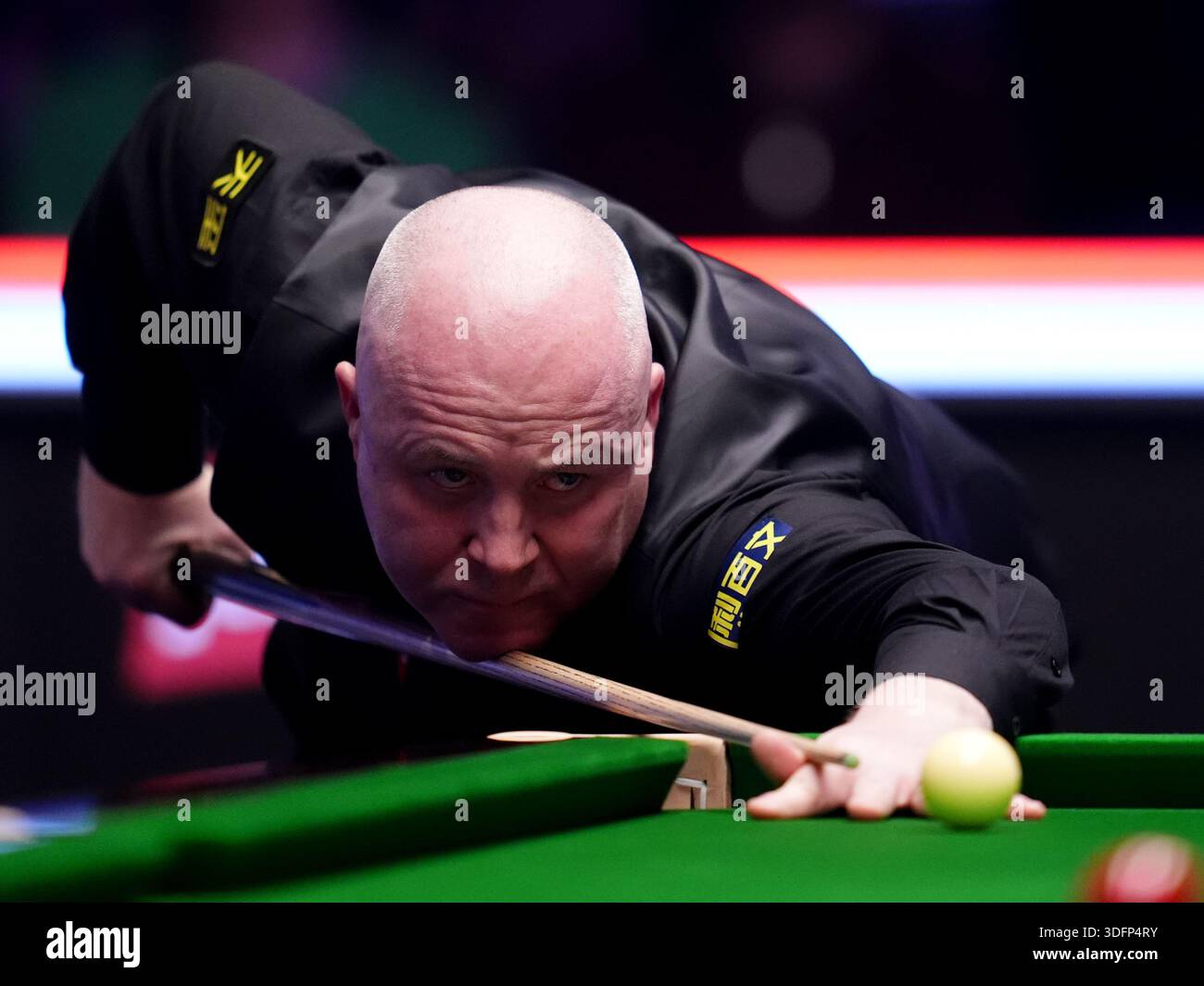 John Higgins in action against Barry Hawkins (out of picture) on day ...
