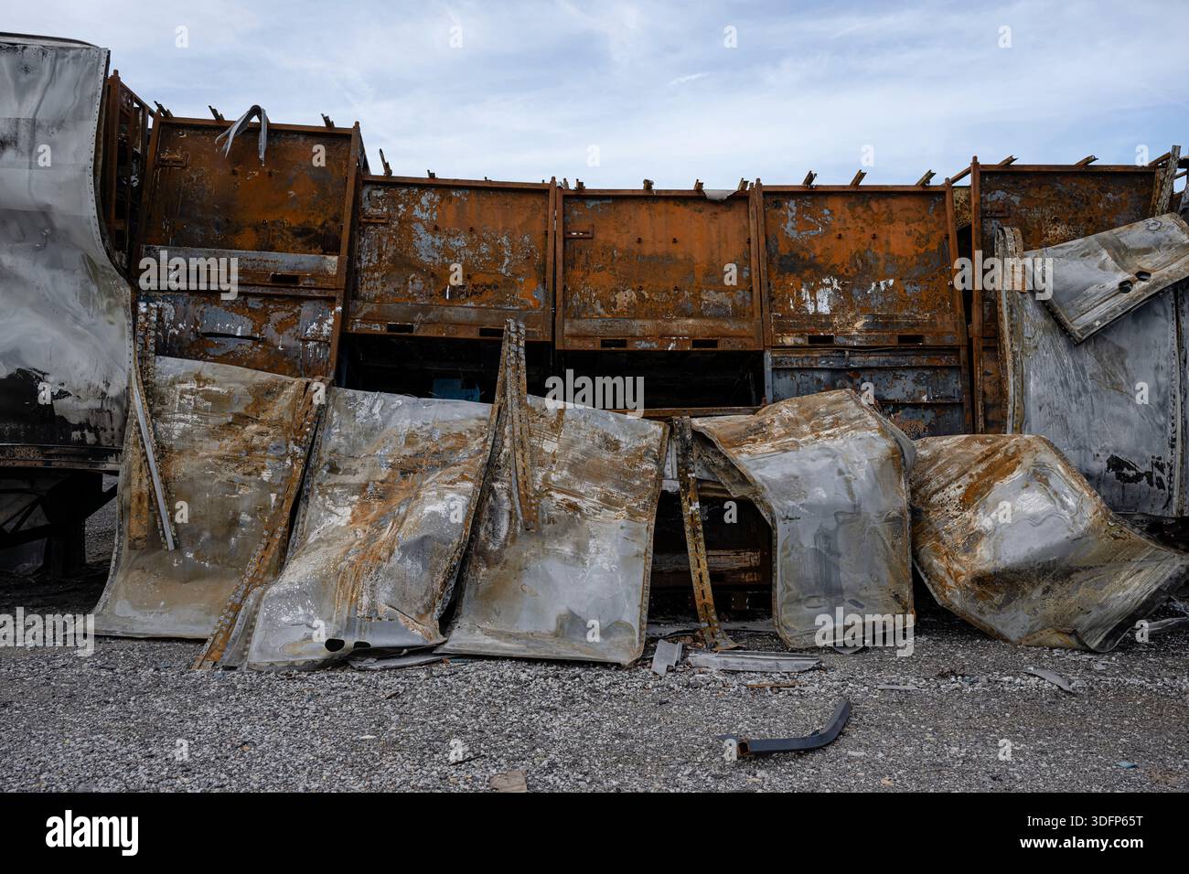 A destroyed tractor trailer, melted by flames, is seen during a tour of ...
