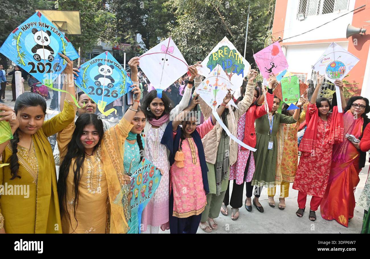 PATNA, INDIA - JANUARY 13: Students holding colourful kites with ...