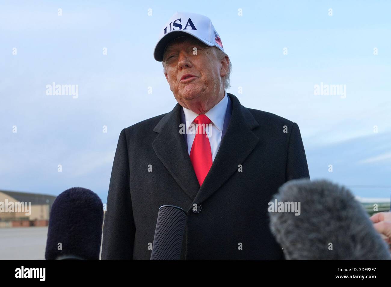 President Donald Trump speaks with reporters at Joint Base Andrews ...