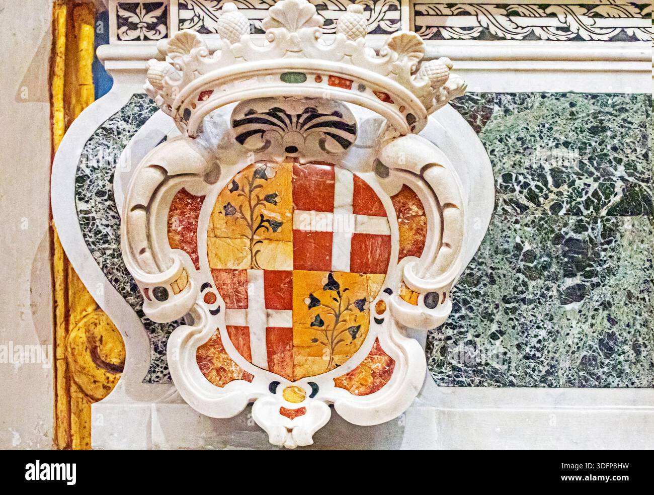 Ivory decorative elements with a crown on a knight's shield Stock Photo ...