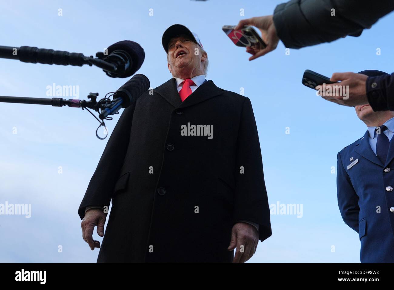 President Donald Trump speaks with reporters at Joint Base Andrews ...