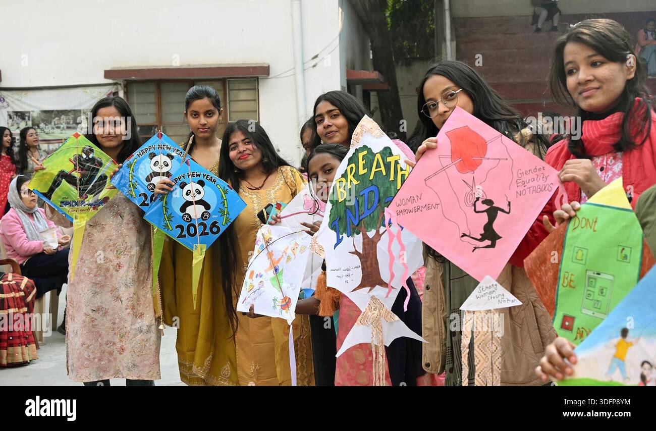 PATNA, INDIA - JANUARY 13: Students holding colourful kites with ...