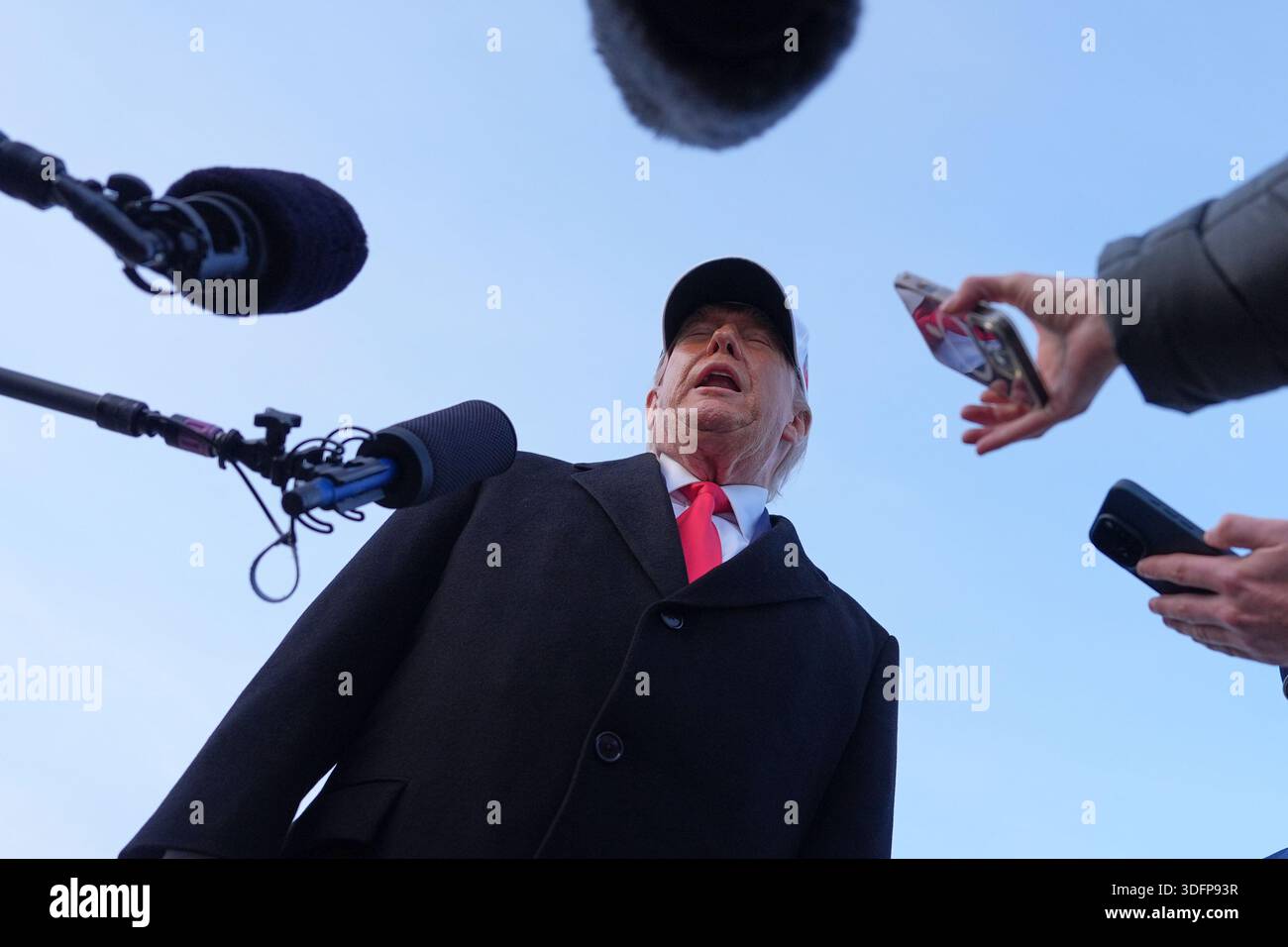 President Donald Trump speaks with reporters at Joint Base Andrews ...