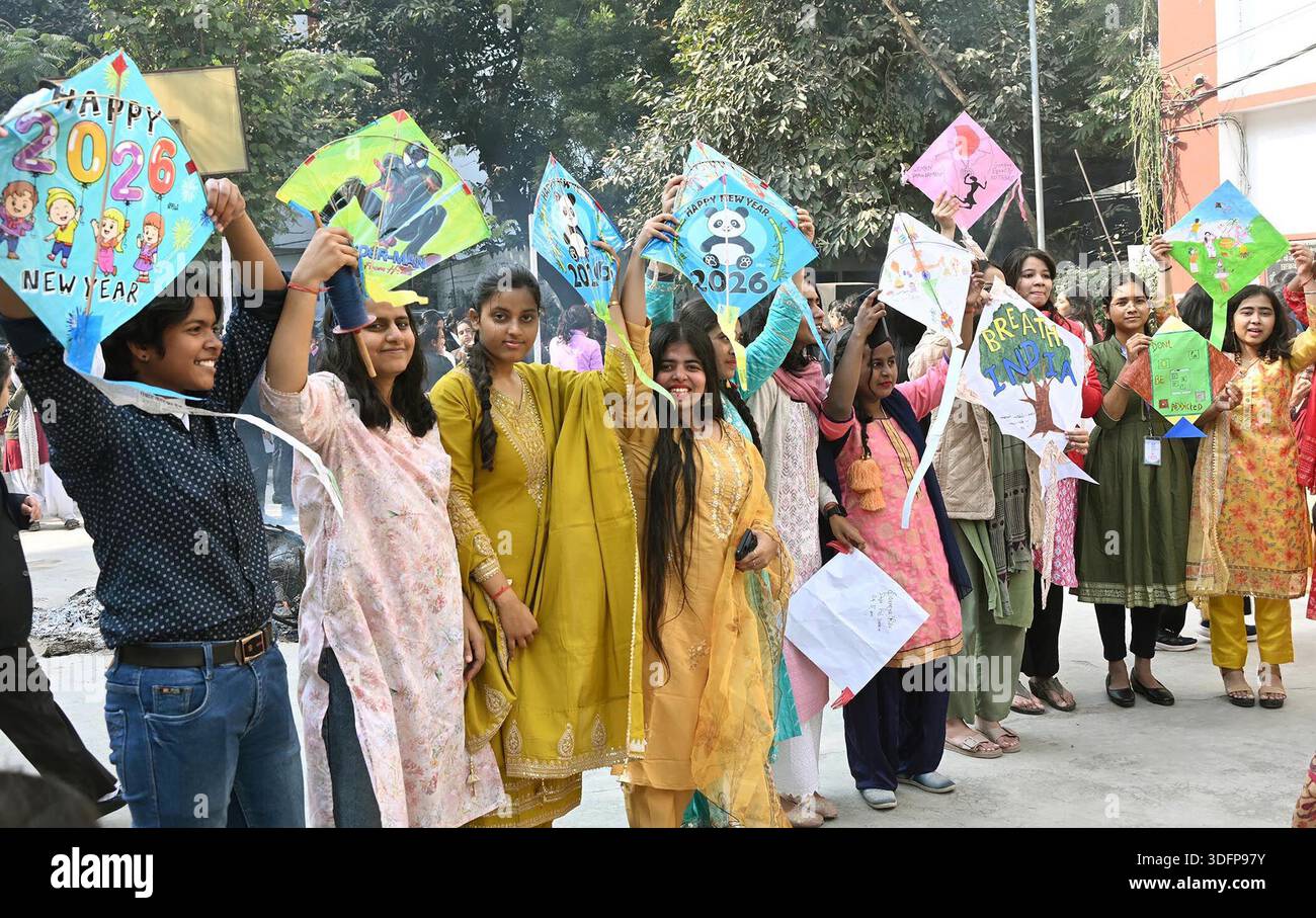PATNA, INDIA - JANUARY 13: Students holding colourful kites with ...