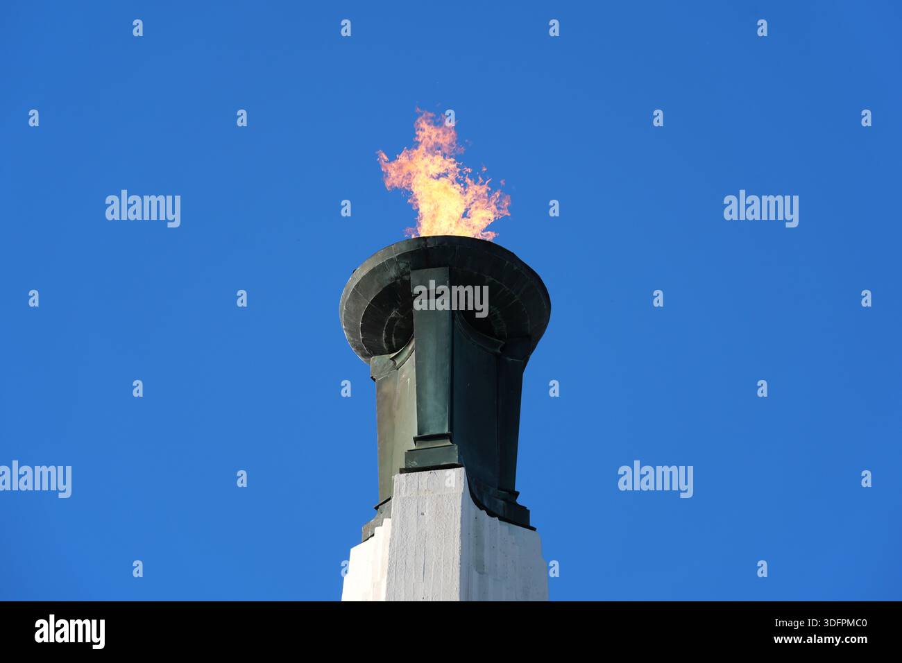 The Olympic cauldron is lit at the Los Angeles Memorial Coliseum ahead ...