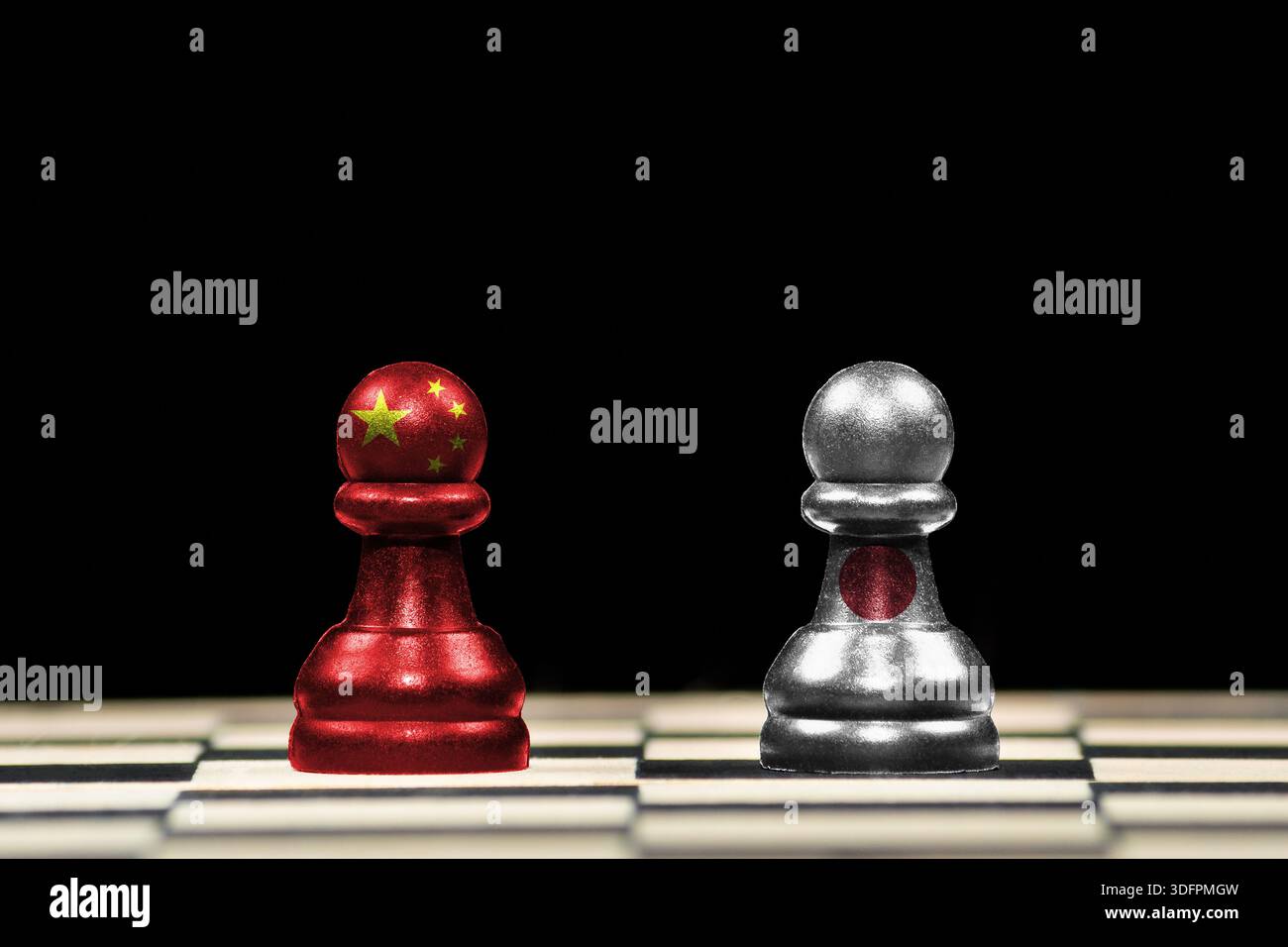 Close up to a two pawns chess pieces with the flags of China and japan ...