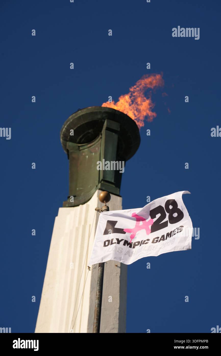 The Olympic cauldron is lit at the Los Angeles Memorial Coliseum ahead ...