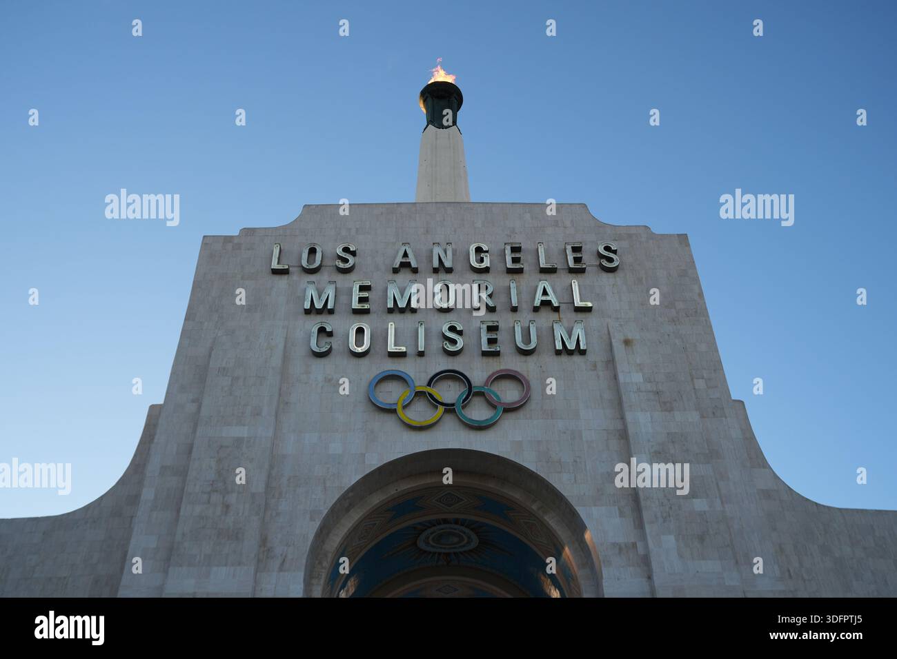 The Olympic cauldron is lit at the Los Angeles Memorial Coliseum ahead ...