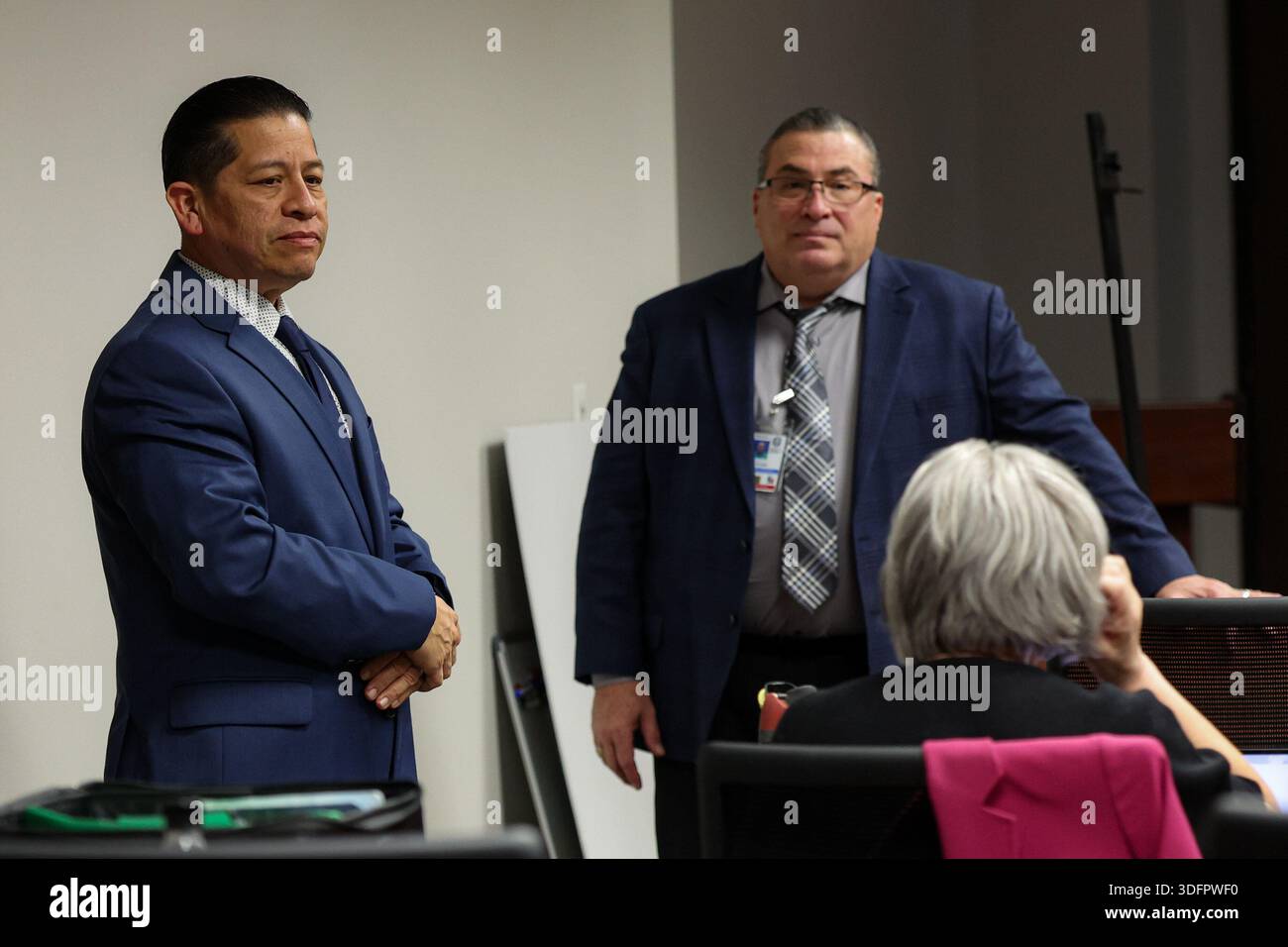 Former Uvalde school district police officer Adrian Gonzales, left ...