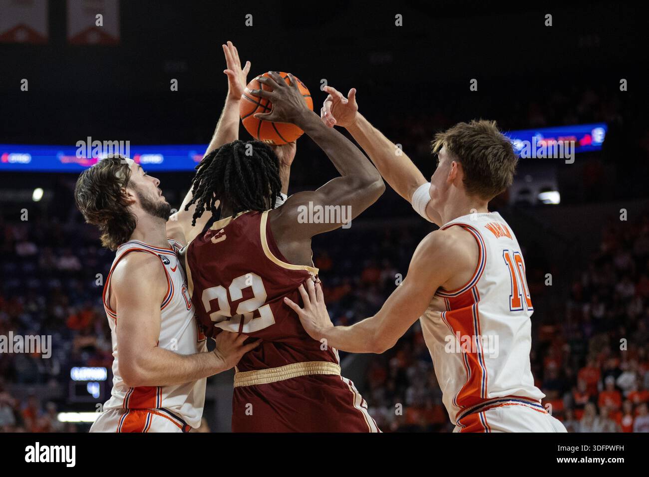 Clemson center Carter Welling (22) and forward Jake Wahlin (10) trap ...