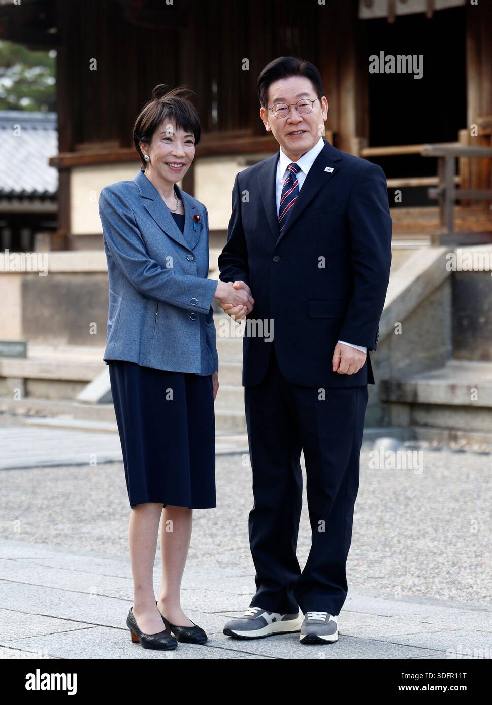 Japanese Prime Minister Sanae Takaichi, left, and South Korean ...